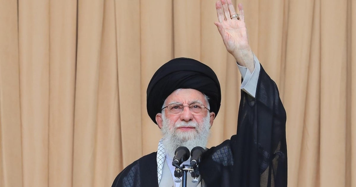 Why Iran's supreme leader appeared with rifle in rare sermon - CBS News