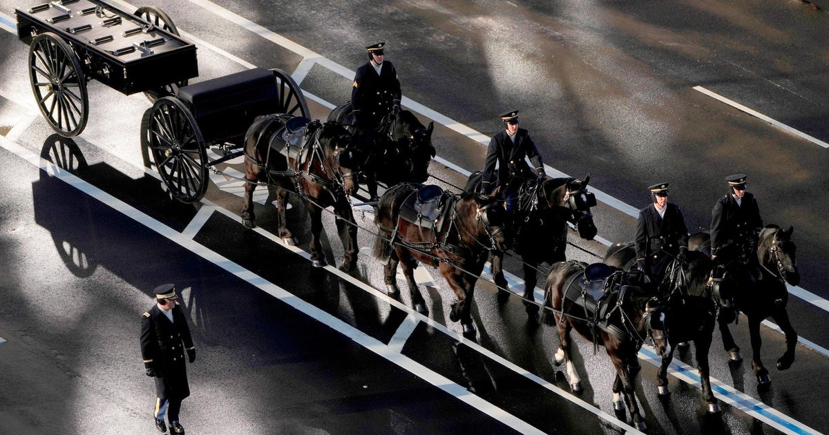Jimmy Carter's casket arriving at U.S. Navy Memorial - CBS News
