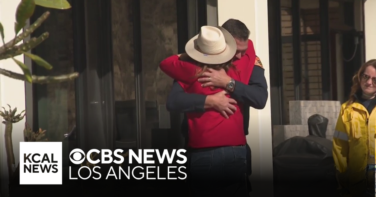 Firefighter reunites with woman he saved during the Palisades Fire ...