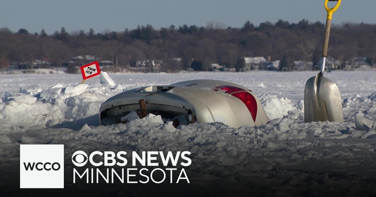 Car stuck in Twin Cities lake becomes viral attraction - CBS Minnesota