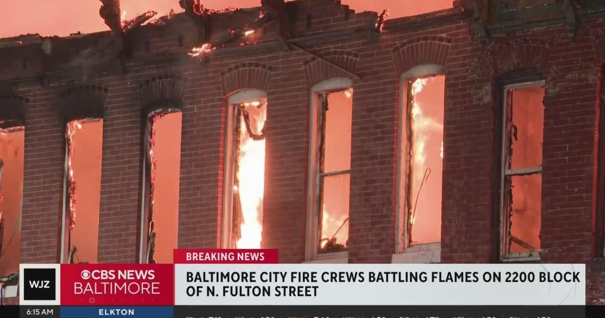 Crews battle fire massive rowhome fire in West Baltimore - CBS Baltimore