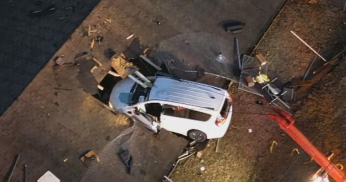 PHOTOS: Van crashes through roof of White Oak garage