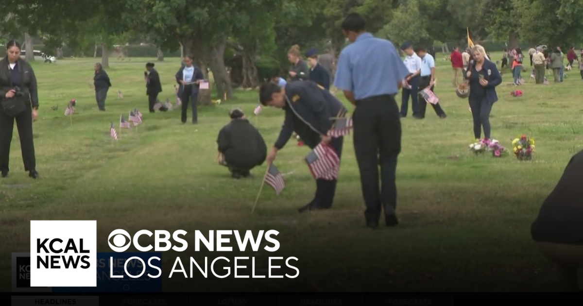 Flags placed on graves of fallen military members at Mission Hills ...