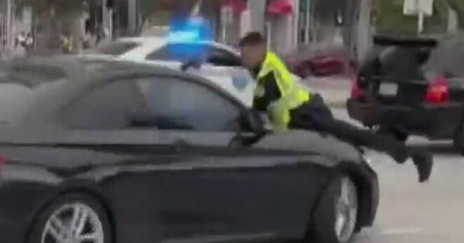 Video shows Miami police officer shooting at driver through windshield ...