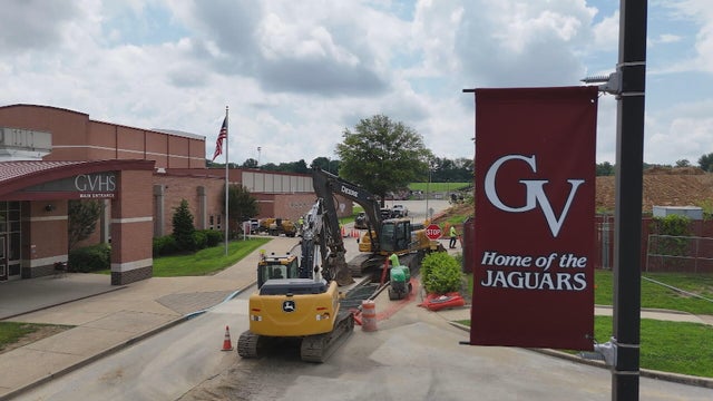 Construction equipment is seen outside the main entrance of Garnet Valley High School 