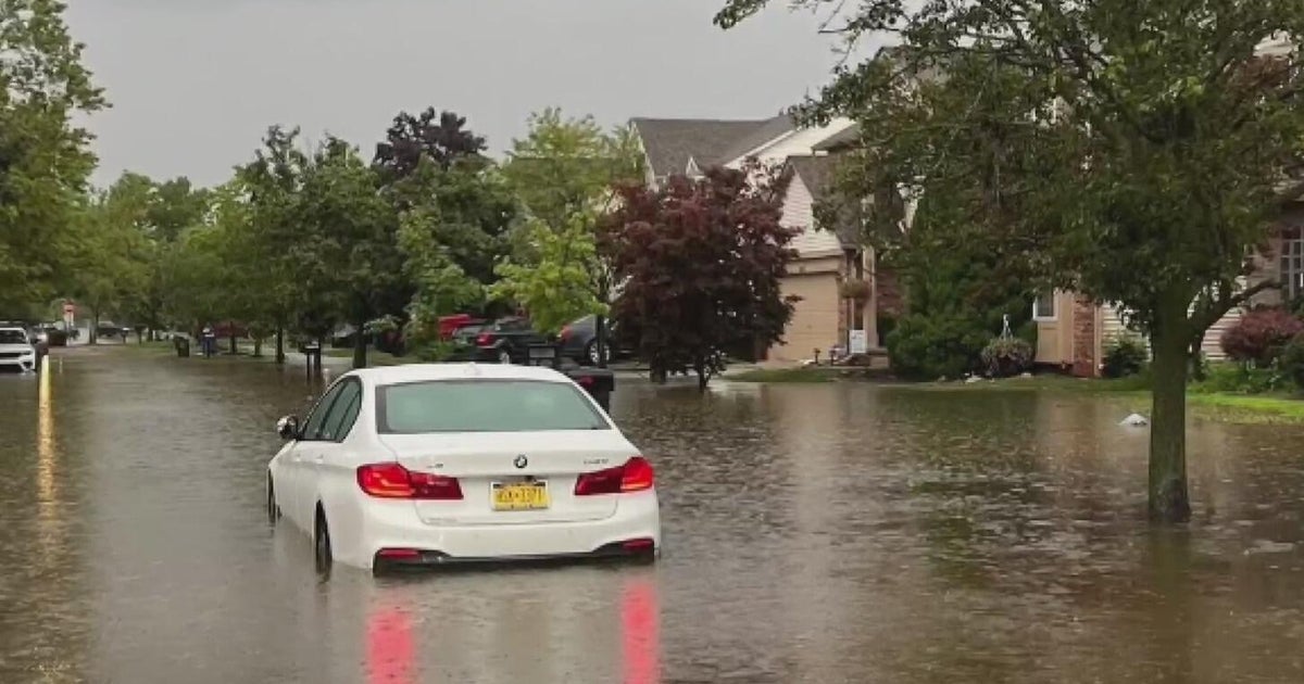 Canton residents clean up after flash flood - CBS Detroit
