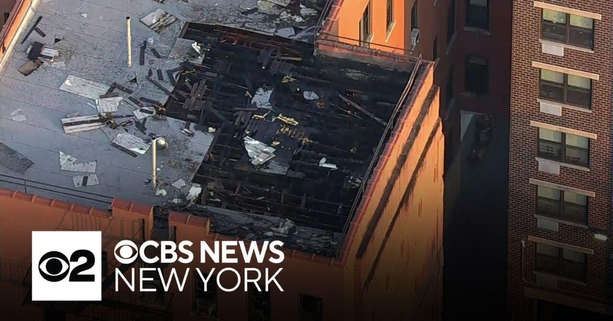 Fire burns through roof of Bronx apartment building - CBS New York