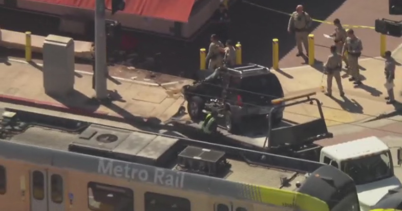 Driver collides with train, slams into sign outside King Taco in East ...