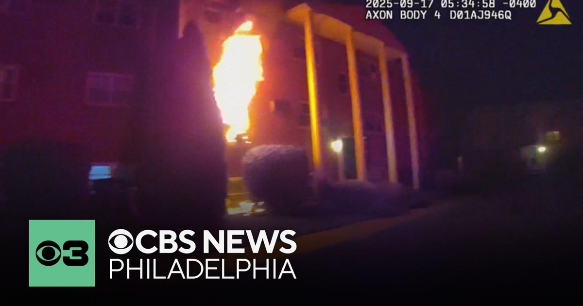 Body camera video shows officer helping man jumping from window of ...