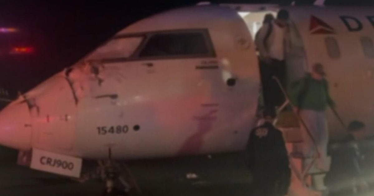 2 planes collide at LaGuardia Airport in NYC - CBS News