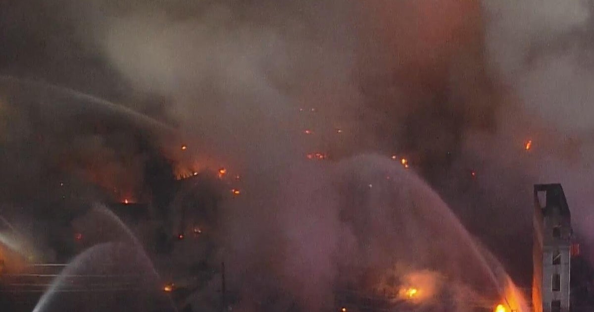 Denver fire crews battle three-alarm fire at building under ...