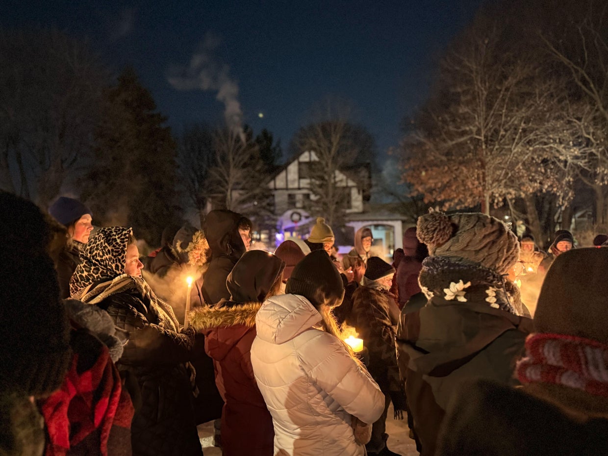 Quiet candlelight vigils light street corners across Twin Cities area ...