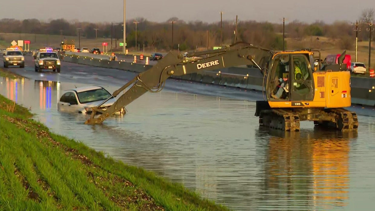 Video shows road crew braving chest-deep water in attempt to clear ...