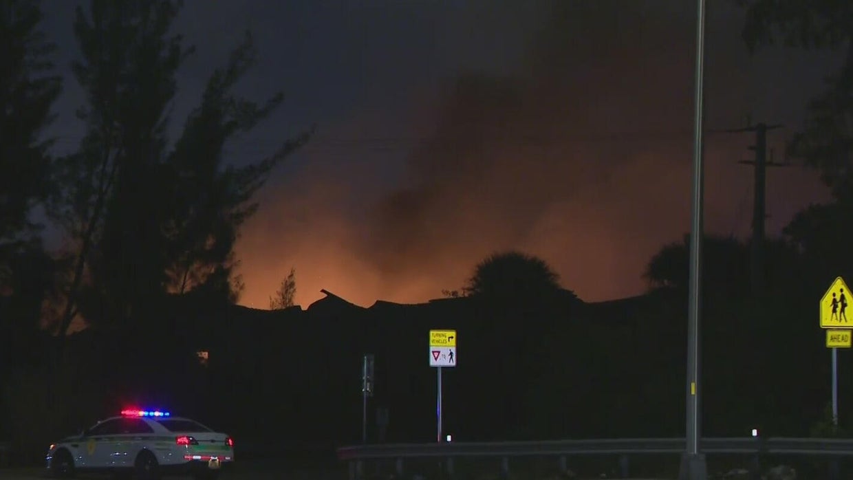 Miami-Dade warehouse fire continues to smolder 24 hours after blaze ...