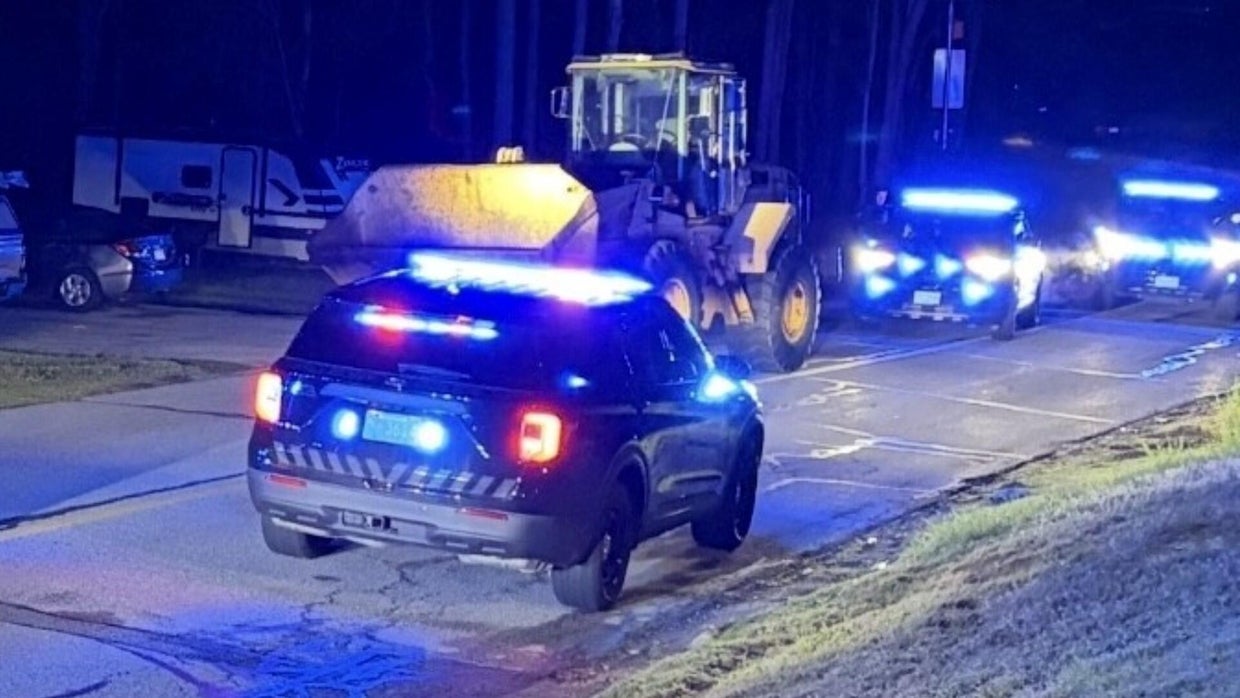 Police arrest man on front-end loader after slow-speed chase through ...